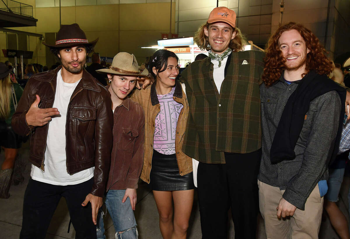 Photos from the Houston Rodeo crowd as Journey and fans sing 'Don't ...