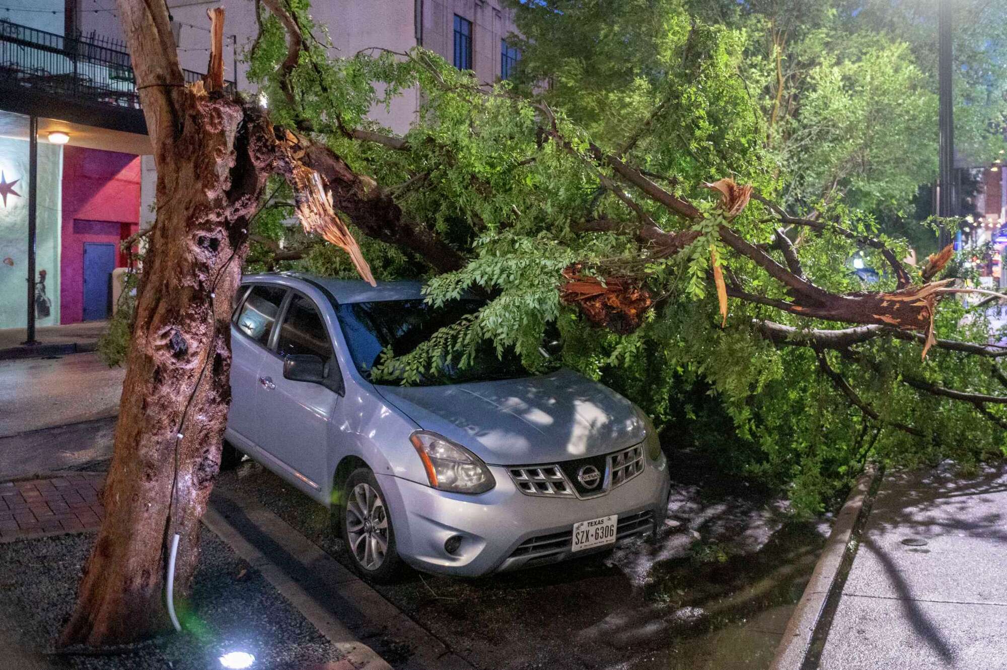 Photos: Houston storm with hurricane-like winds causes destruction