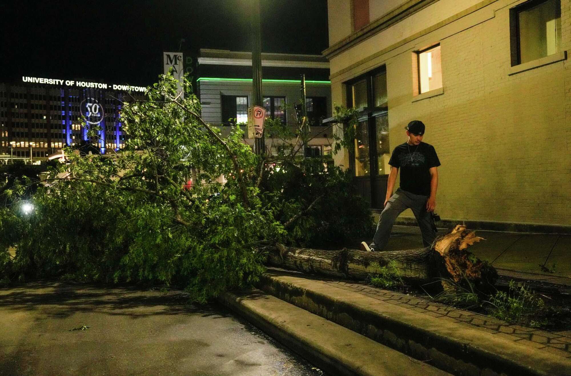 Photos: Houston storm with hurricane-like winds causes destruction