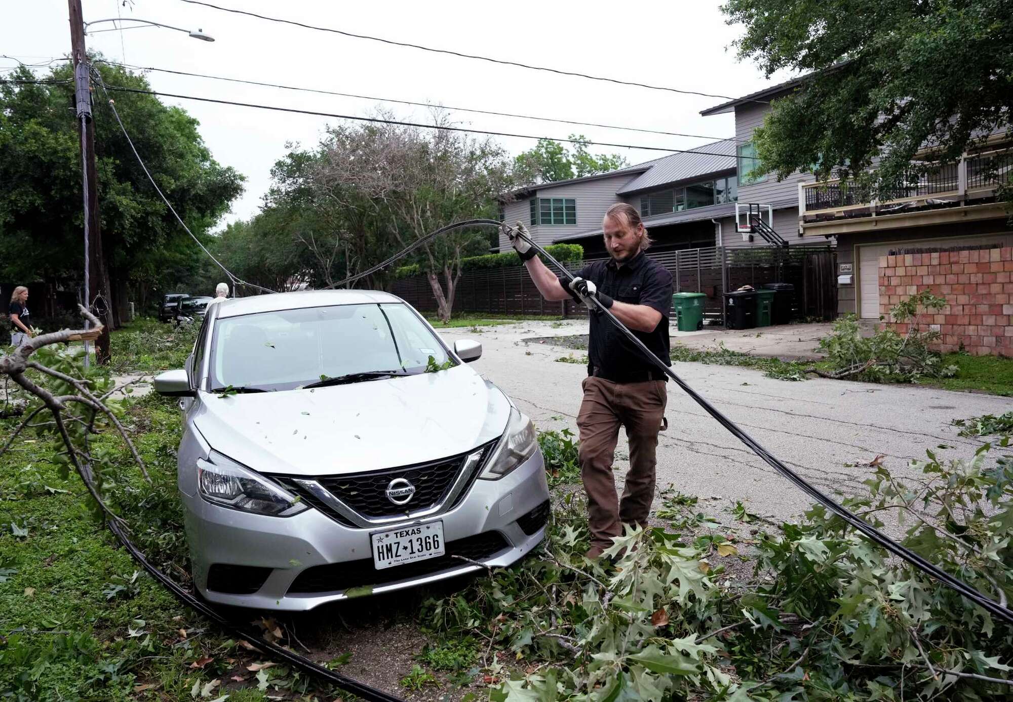 Photos: Houston storm with hurricane-like winds causes destruction