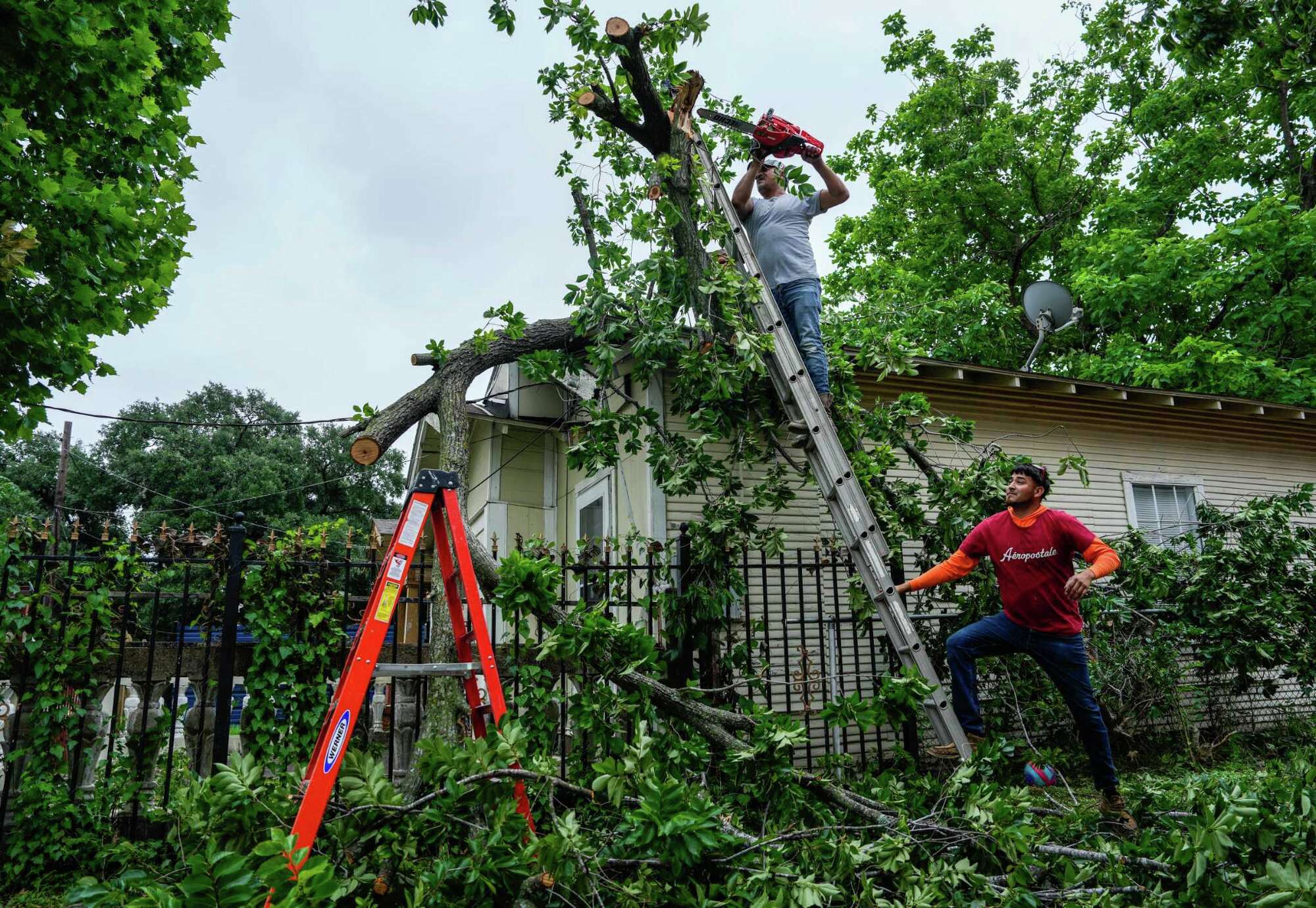 Photos: Houston storm with hurricane-like winds causes destruction