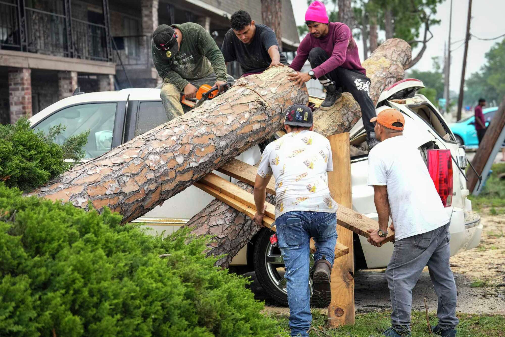 Photos: Houston storm with hurricane-like winds causes destruction