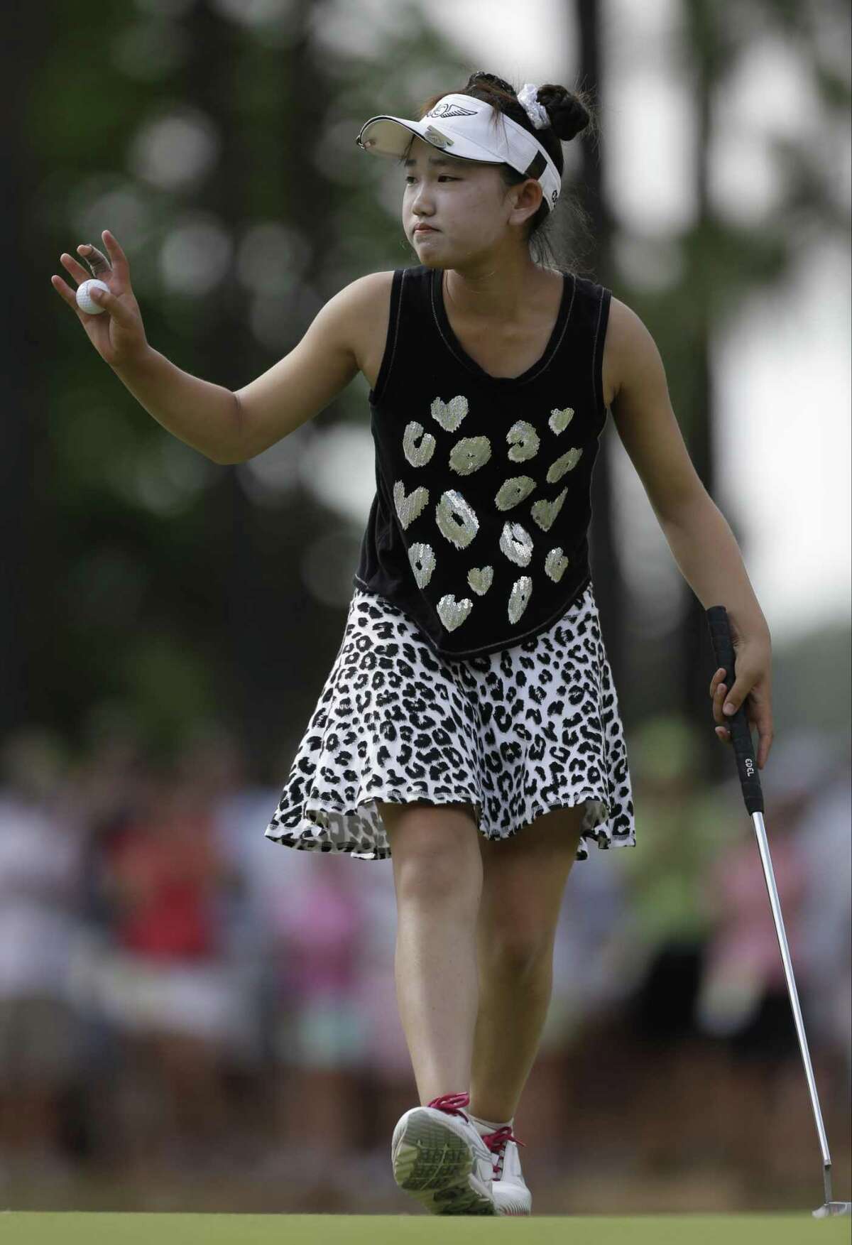Golfer Lucy Li's Apple ad offers test, but amateurism still matters