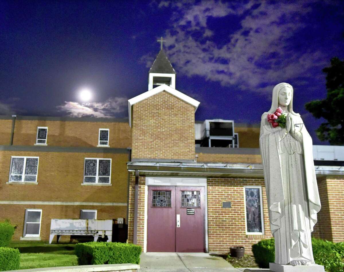 Pain mingles with acceptance as closed Catholic churches are sold