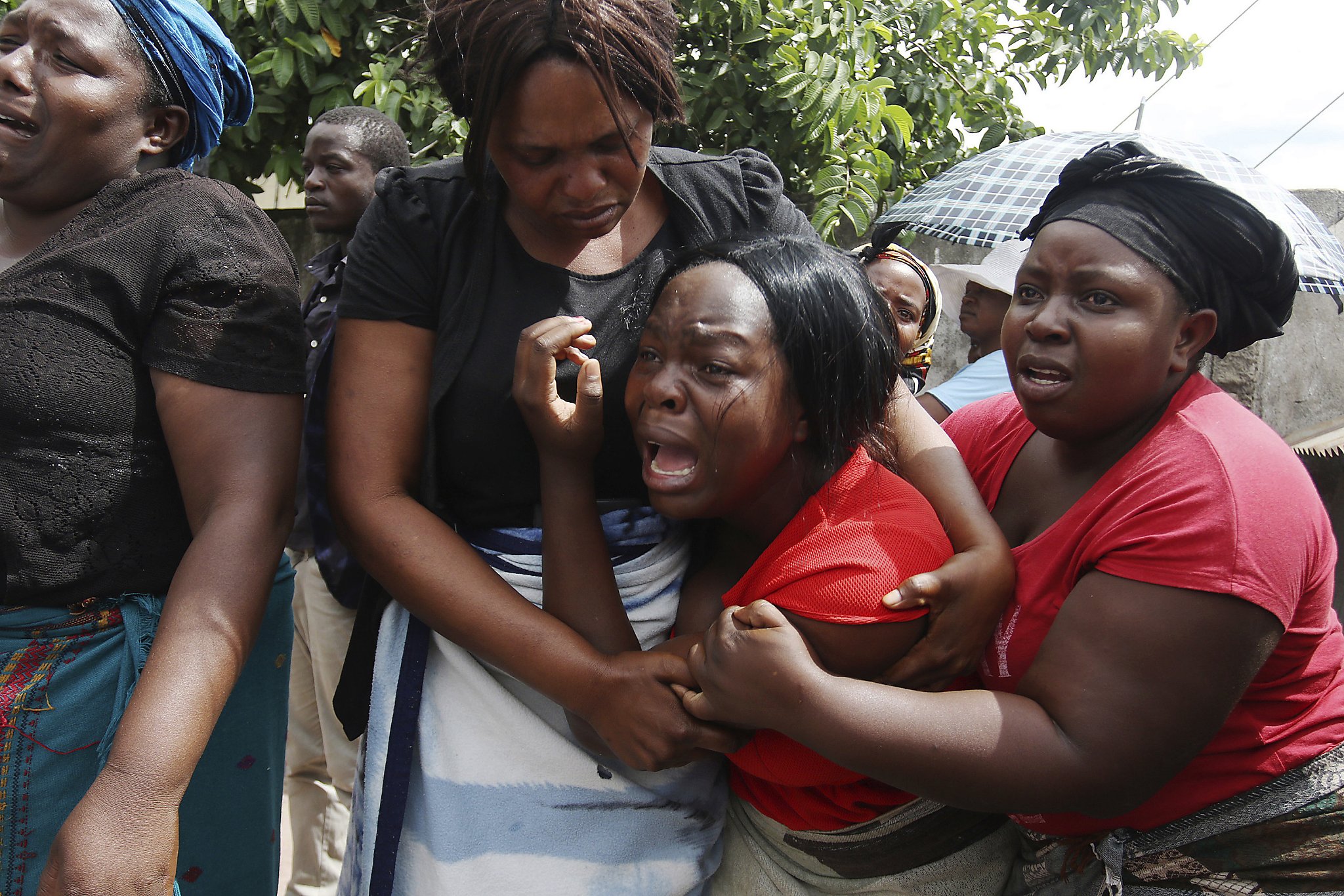 Economic chaos in Zimbabwe spurs protests, deadly reprisals