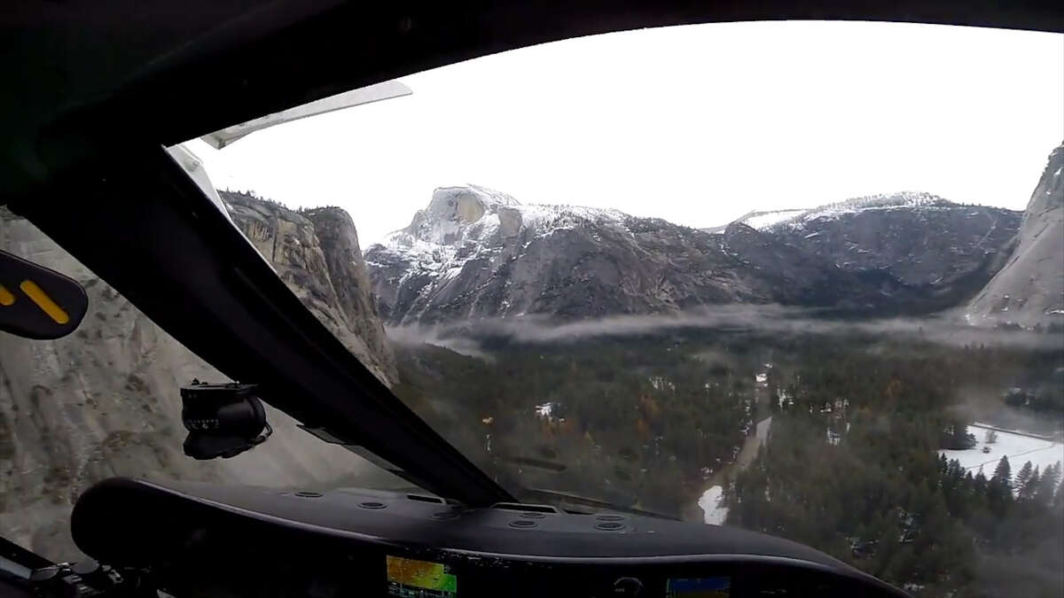 See a helicopter rescue two hikers who were wedged in a crevasse in ...