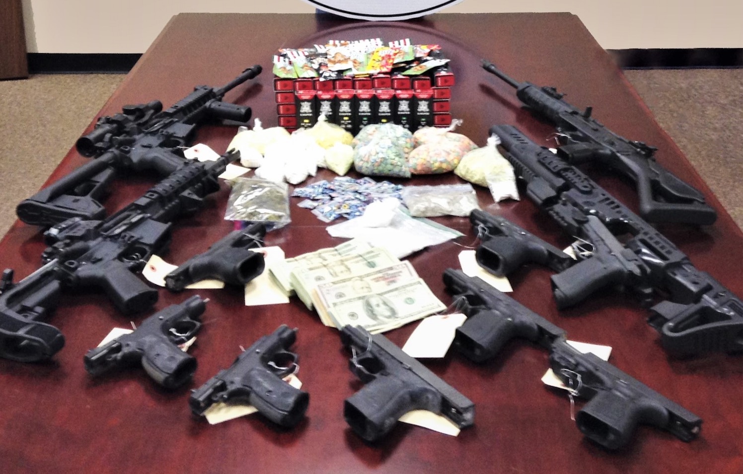 Cache of guns, drugs found after surprise raid in southwest Houston