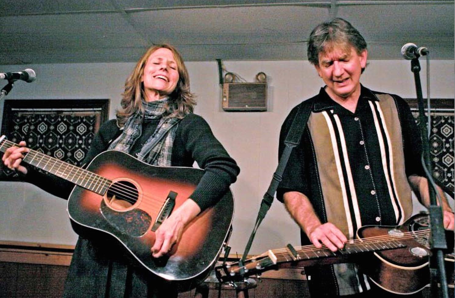 Jim Henry shares musical talents on stage with Tracy Grammer at Voices Cafe