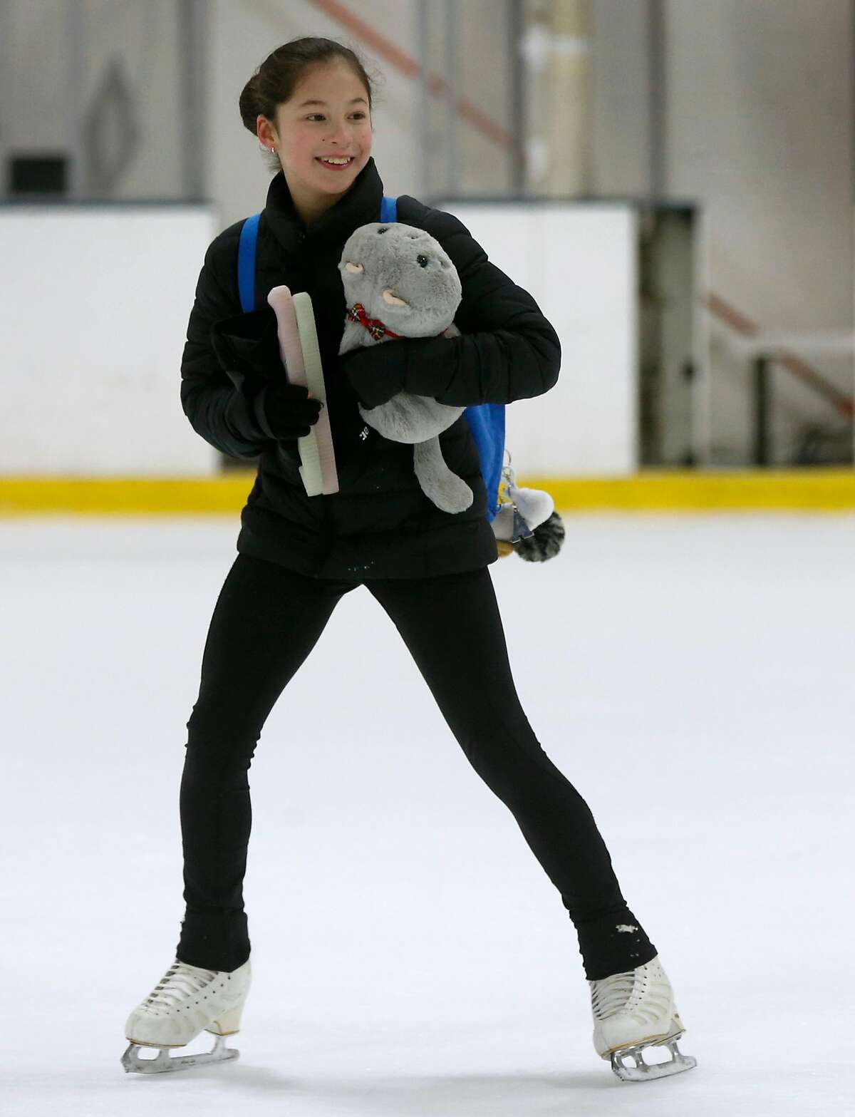 Figure skater Alysa Liu returns home a champion, yet still a kid