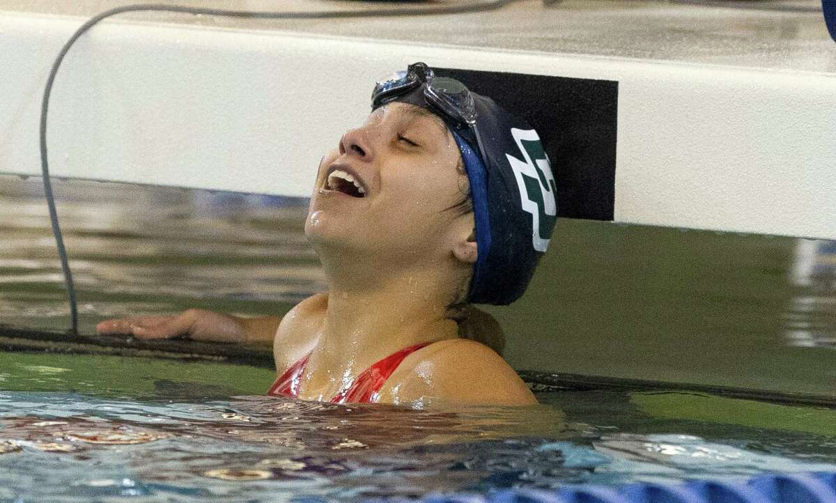 SWIMMING: The Woodlands triumphs at regional meet; Hinze makes Conroe ...