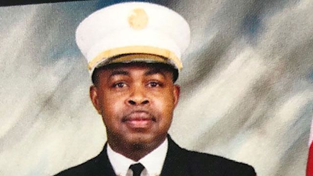 Fire division chief shot by stray bullet while lying in bed