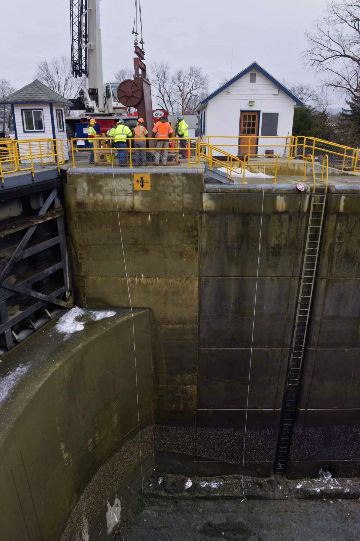 Workers give canal lock a big lift