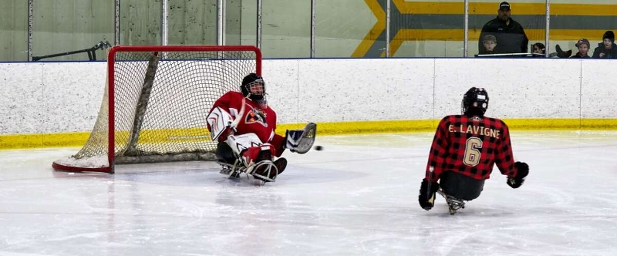 Injured veteran finds place on ice with sled hockey team
