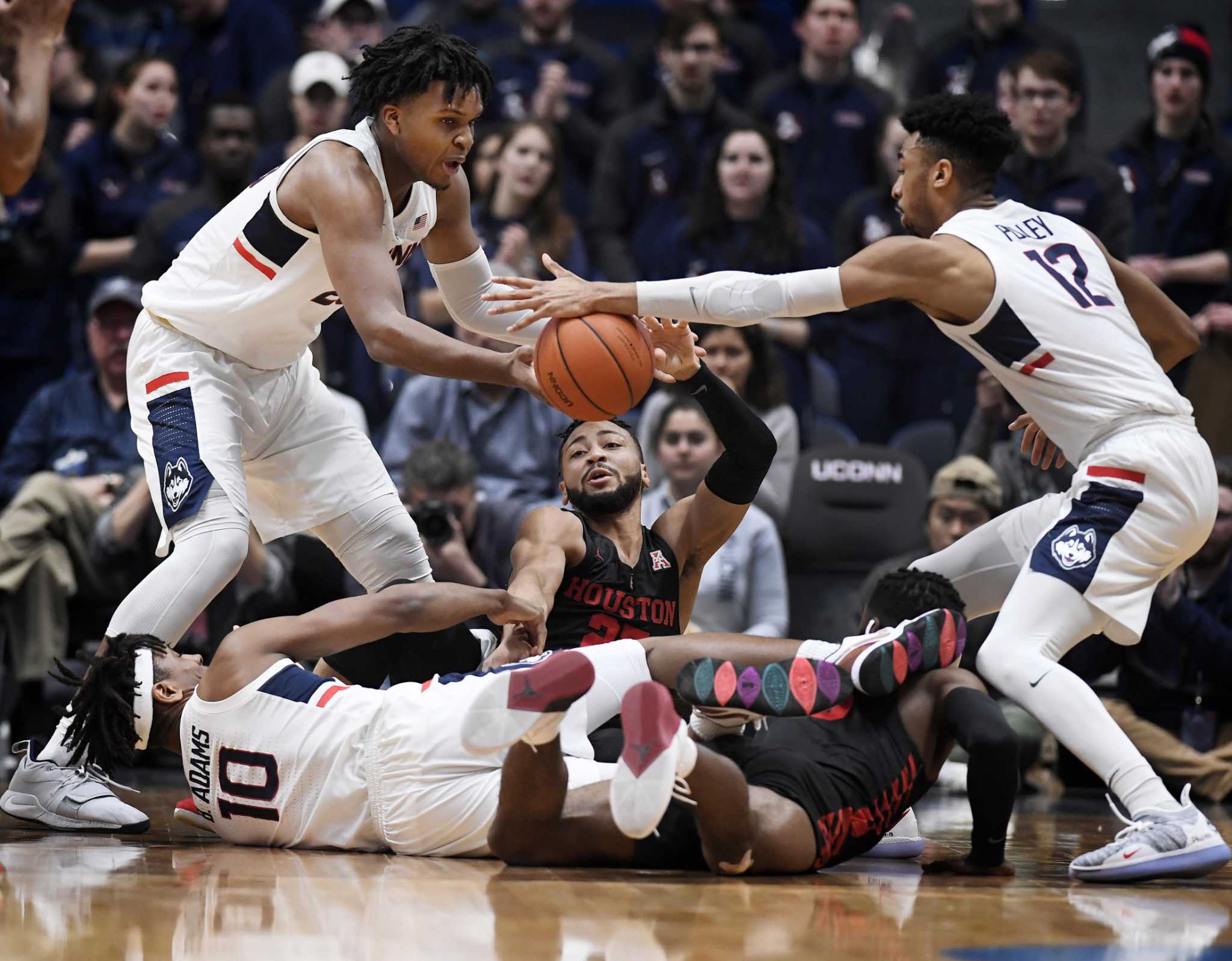 No. 9 Houston shoots, dunks its way past UConn