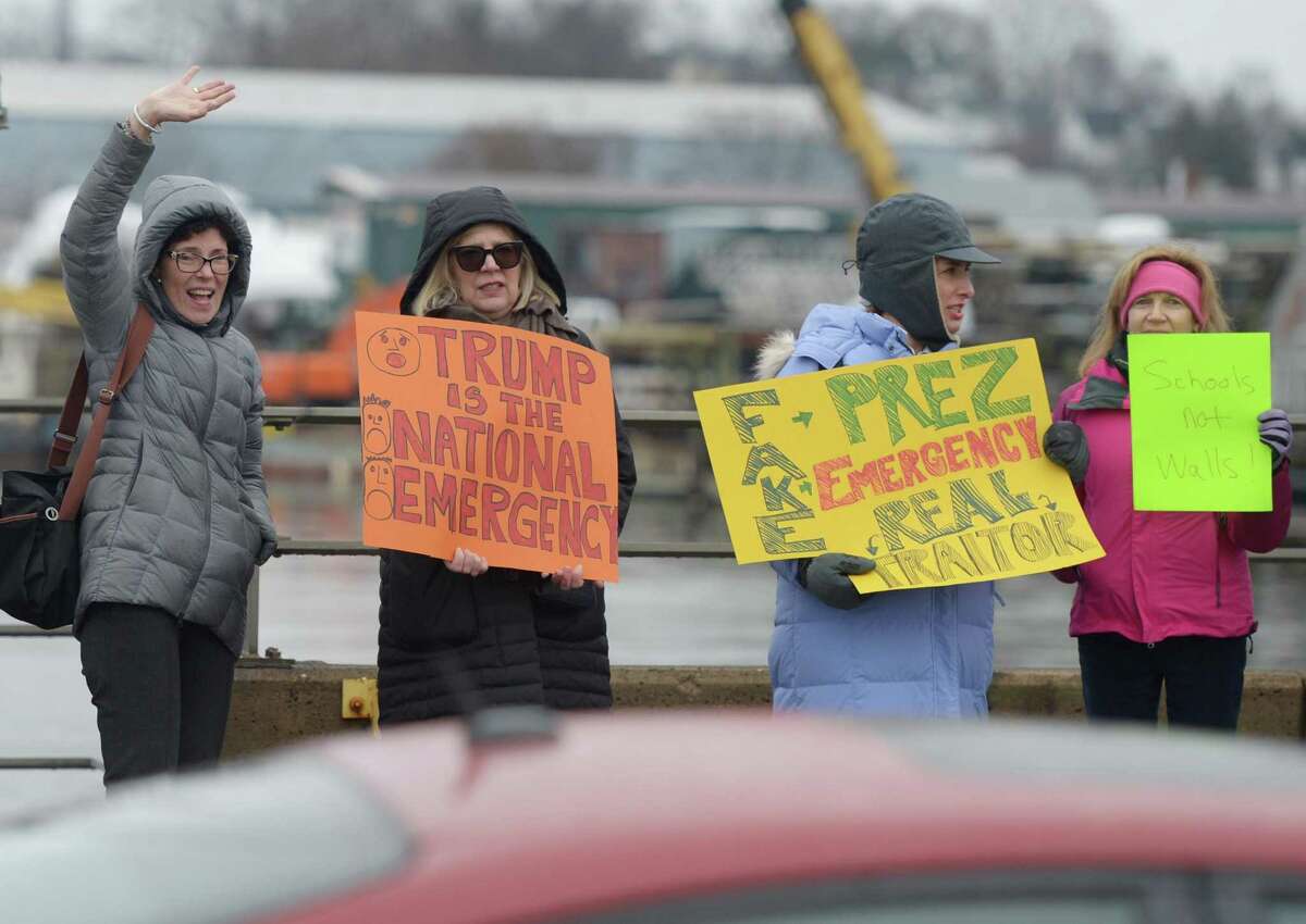 Dozens protest in Norwalk against Trump’s border wall national emergency