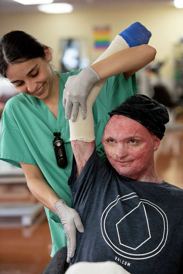 A fire killed his friends. A leap saved his life. After 23 surgeries ...