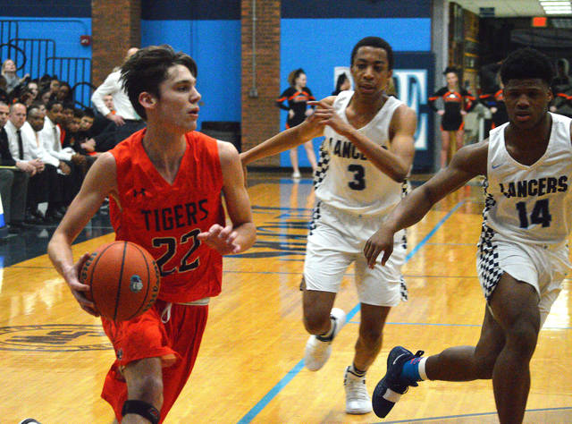 BOYS BASKETBALL: Tigers build momentum with win over Lancers