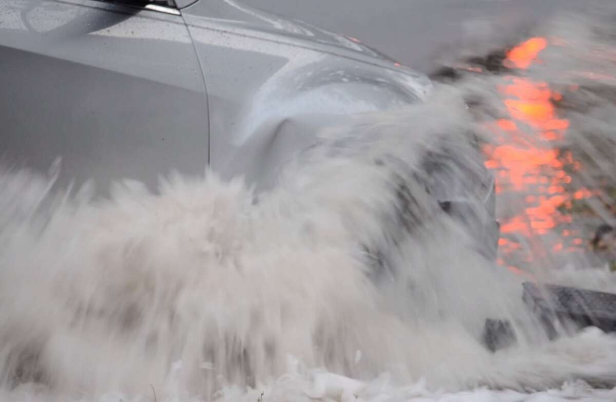 Gusher drenches Rice Village street after car slams into fire hydrant