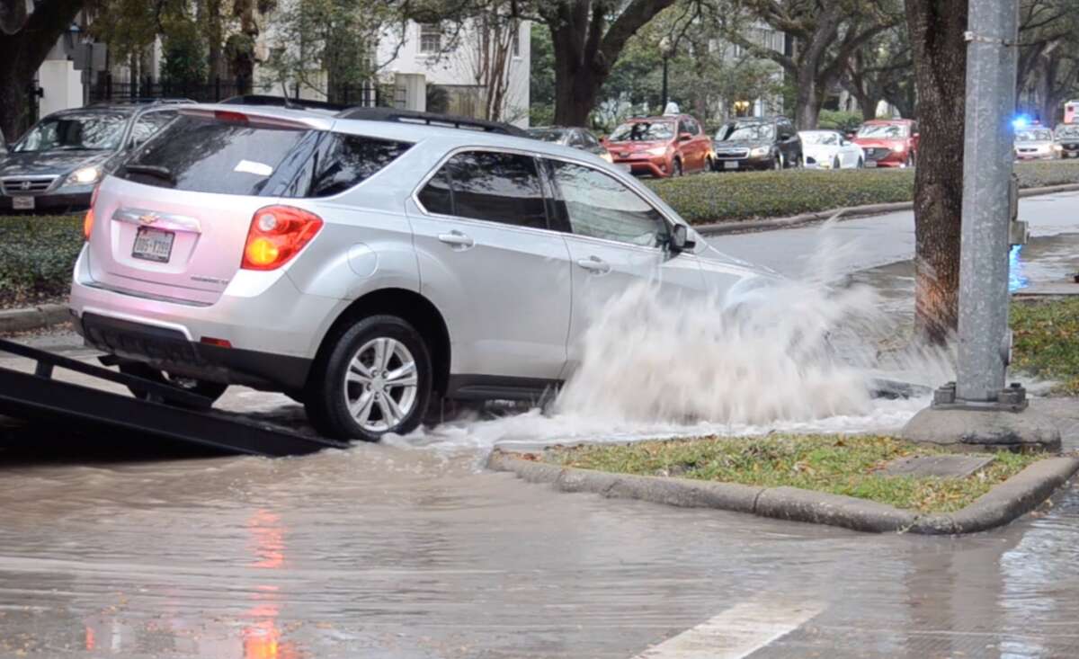 Gusher drenches Rice Village street after car slams into fire hydrant