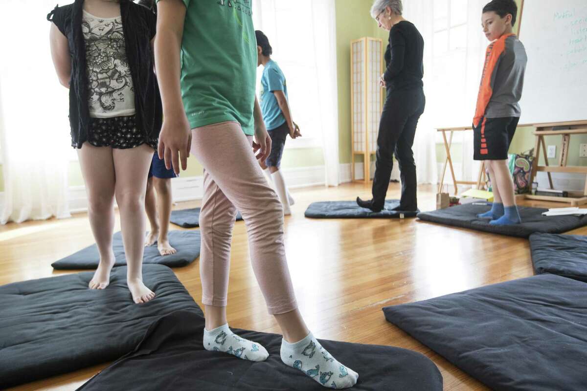 Mindfulness for third-graders? Meditation, yoga help kids ward off ...