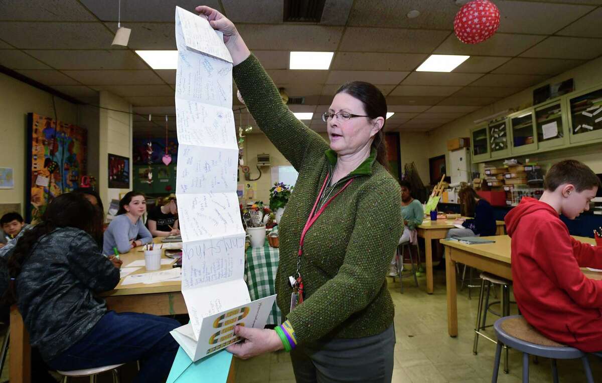 Students, staff from Nathan Hale help longtime educator mark 100th birthday