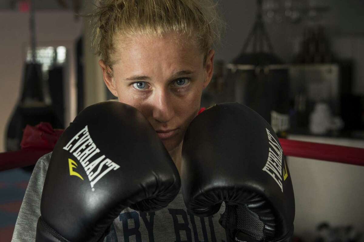 Houston boxer Ginny Fuchs and the opponent outside the ring