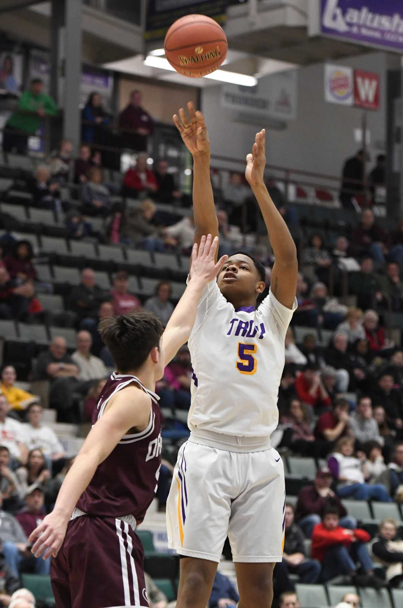 Statistics do not define Lateef Johnson's value to Troy boys' basketball