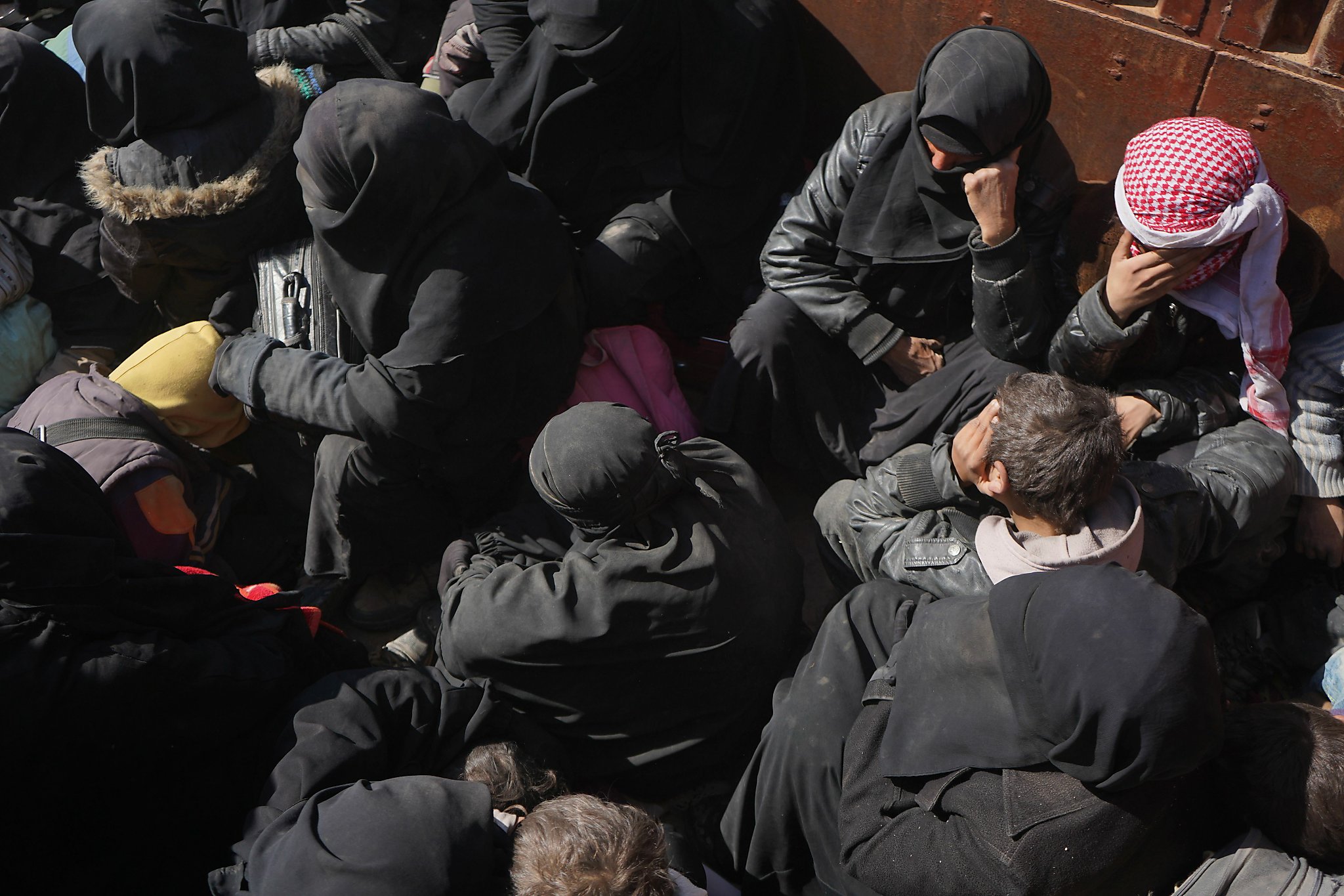 Angry, defiant, Islamic State families surrender in Syria