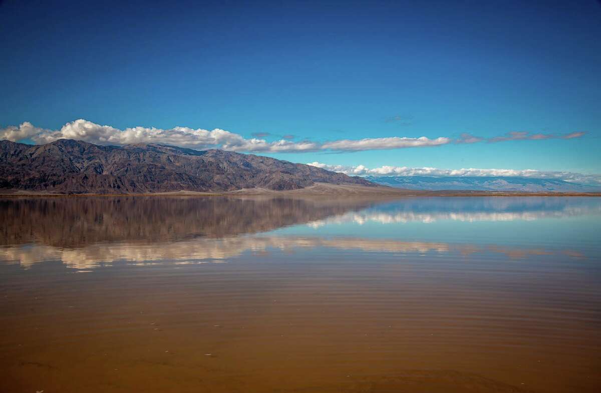 Rare 10-mile-long lake forms in Death Valley after heavy rains and flooding