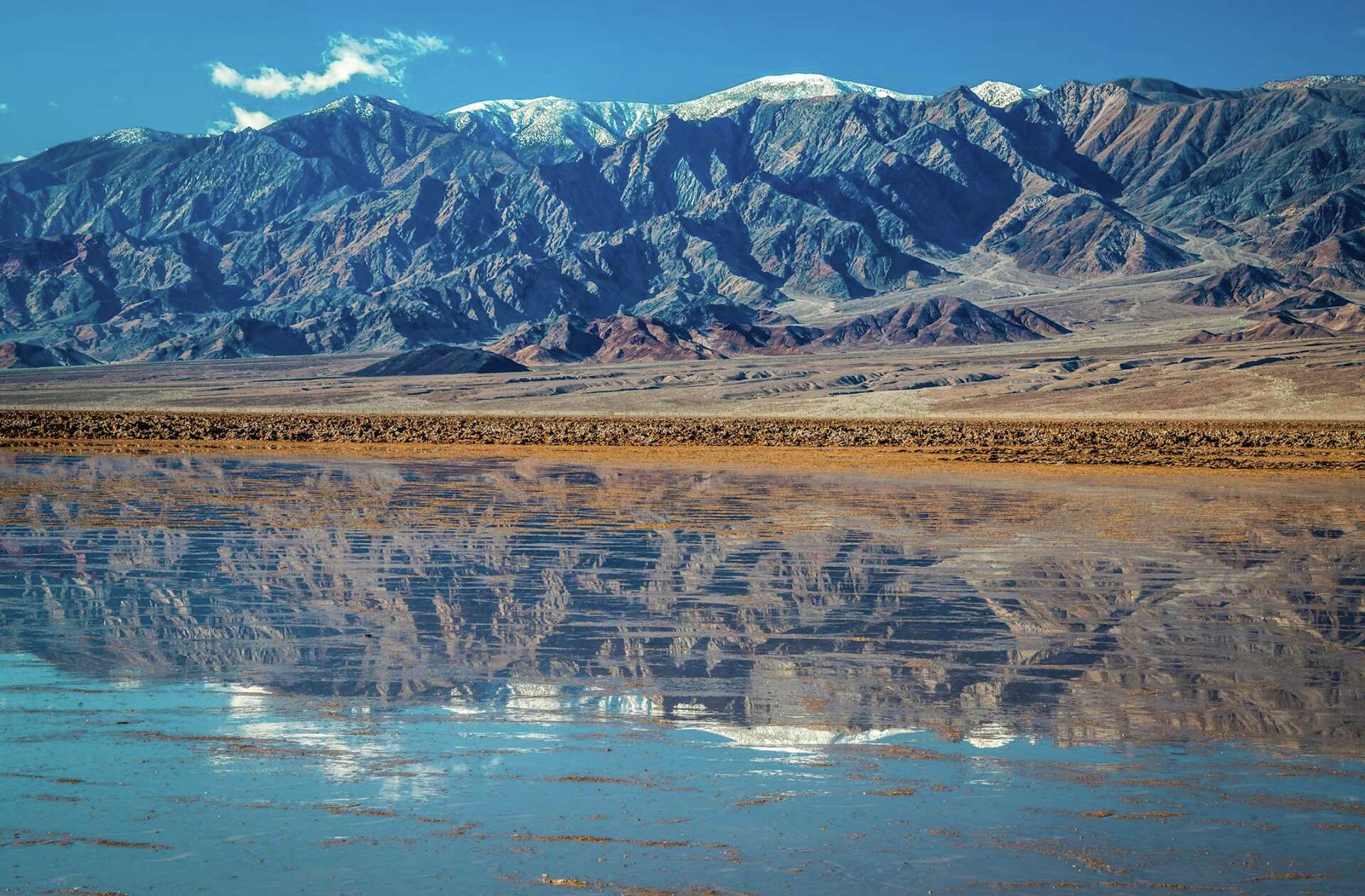 Rare 10-mile-long lake forms in Death Valley after heavy rains and flooding