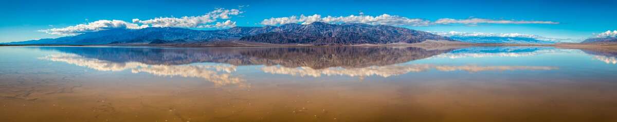 Rare 10-mile-long lake forms in Death Valley after heavy rains and flooding
