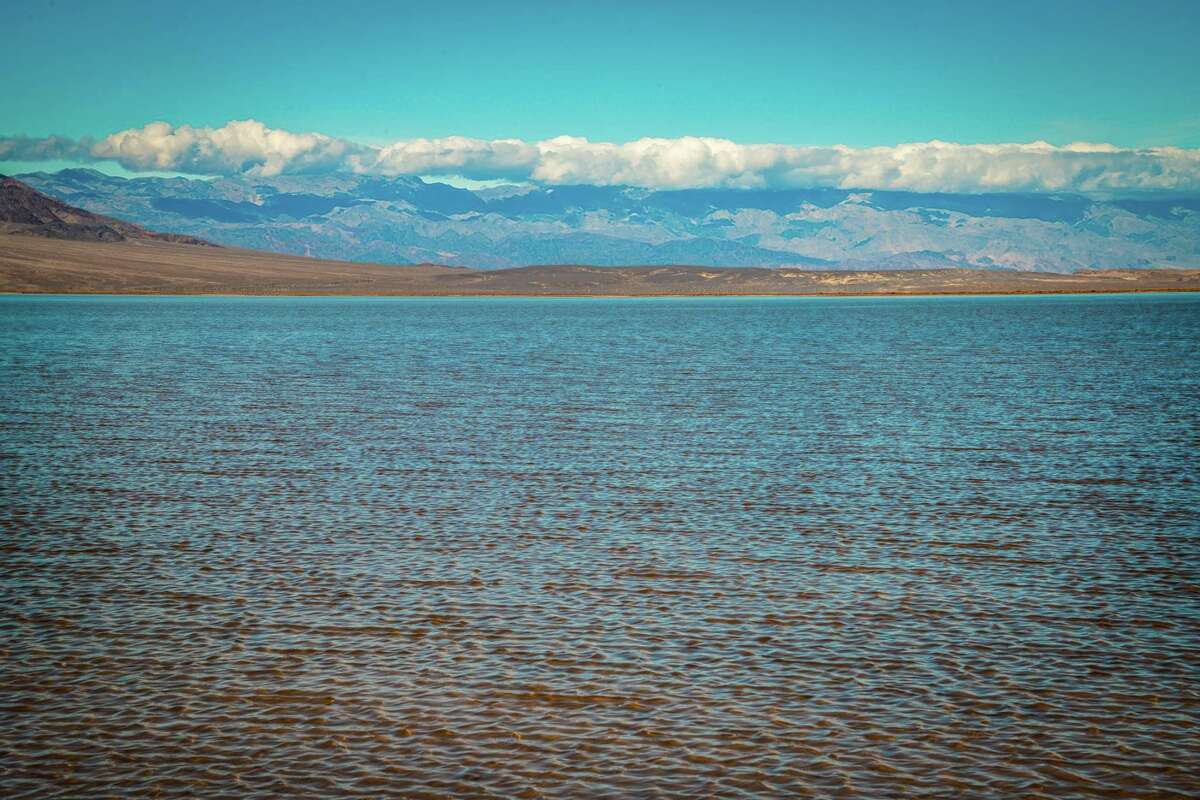 Rare 10-mile-long lake forms in Death Valley after heavy rains and flooding