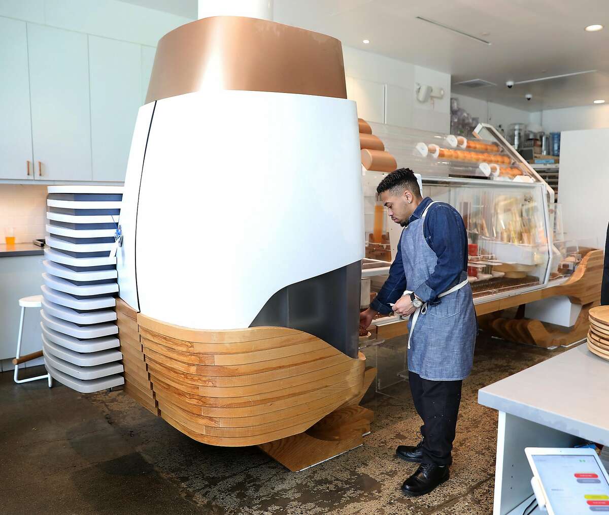 At Creator, a robot makes your burger. It doesn’t make you any less ...