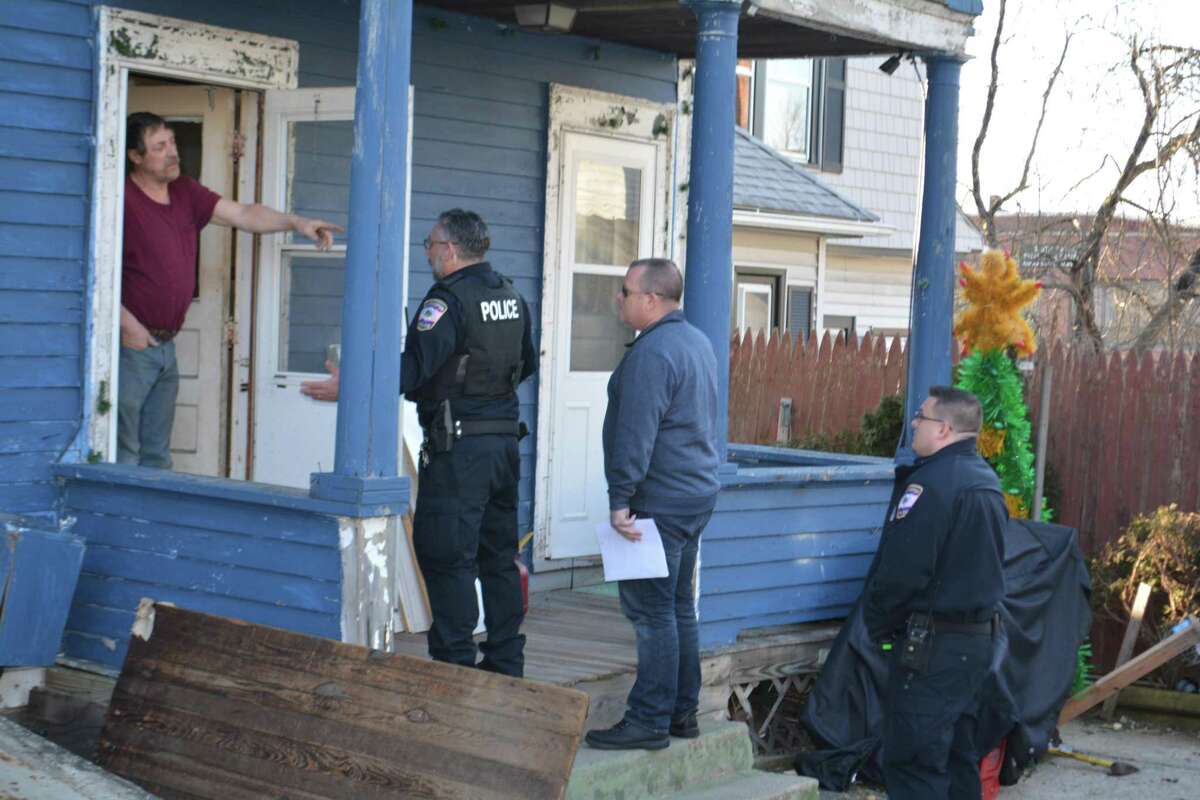 Torrington police escort Merriman out of ‘Christmas House’