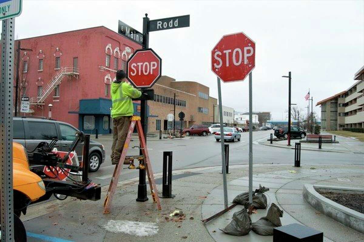 Stop signs, street names getting installed in downtown Midland