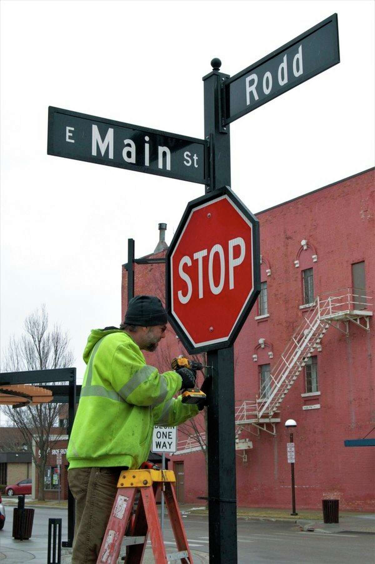 Stop signs, street names getting installed in downtown Midland