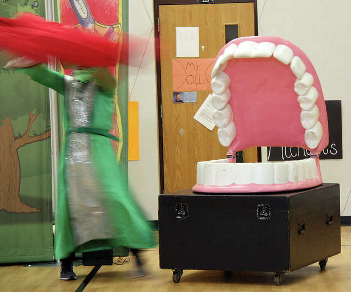 Tooth Wizard, PlaqueMan put on educational show at Nelson Elementary