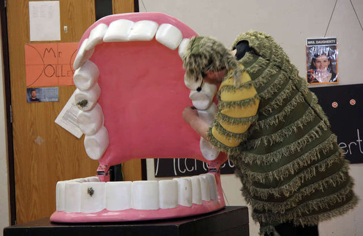 Tooth Wizard, PlaqueMan put on educational show at Nelson Elementary