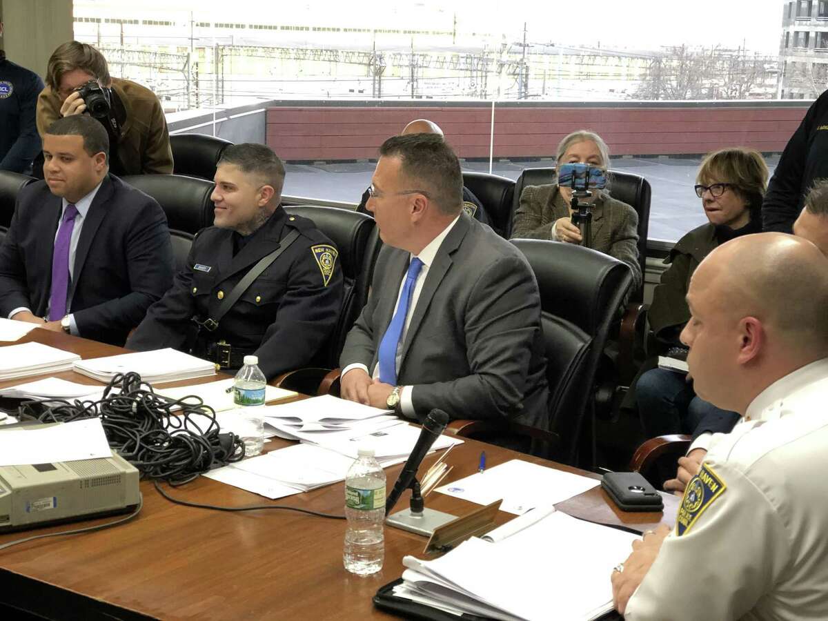 New Haven cop facing termination agrees to cover tattoos