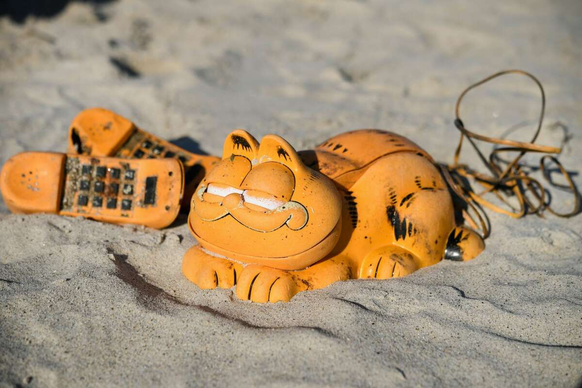 For 30 years, Garfield phones kept washing up on a French beach. Now ...