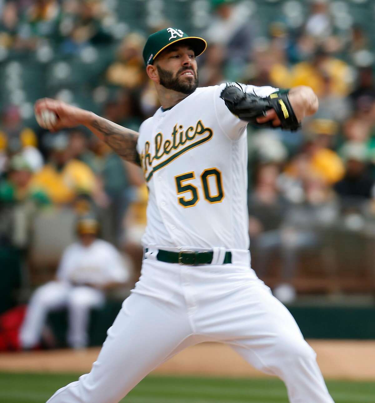 A’s, back home, use power, Fiers to beat Angels 4-0