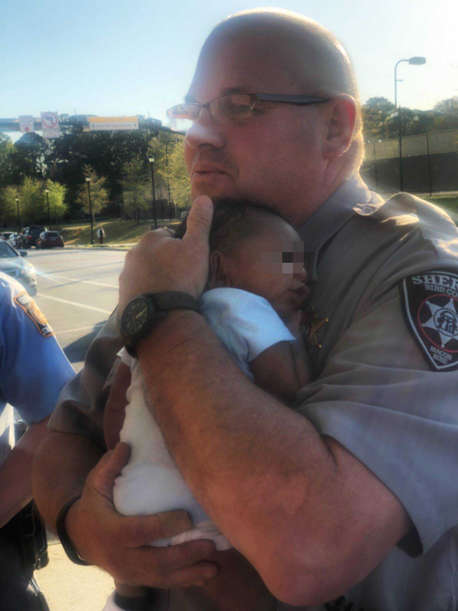 'So proud of him': Photos of deputy calming baby during traffic stop go ...