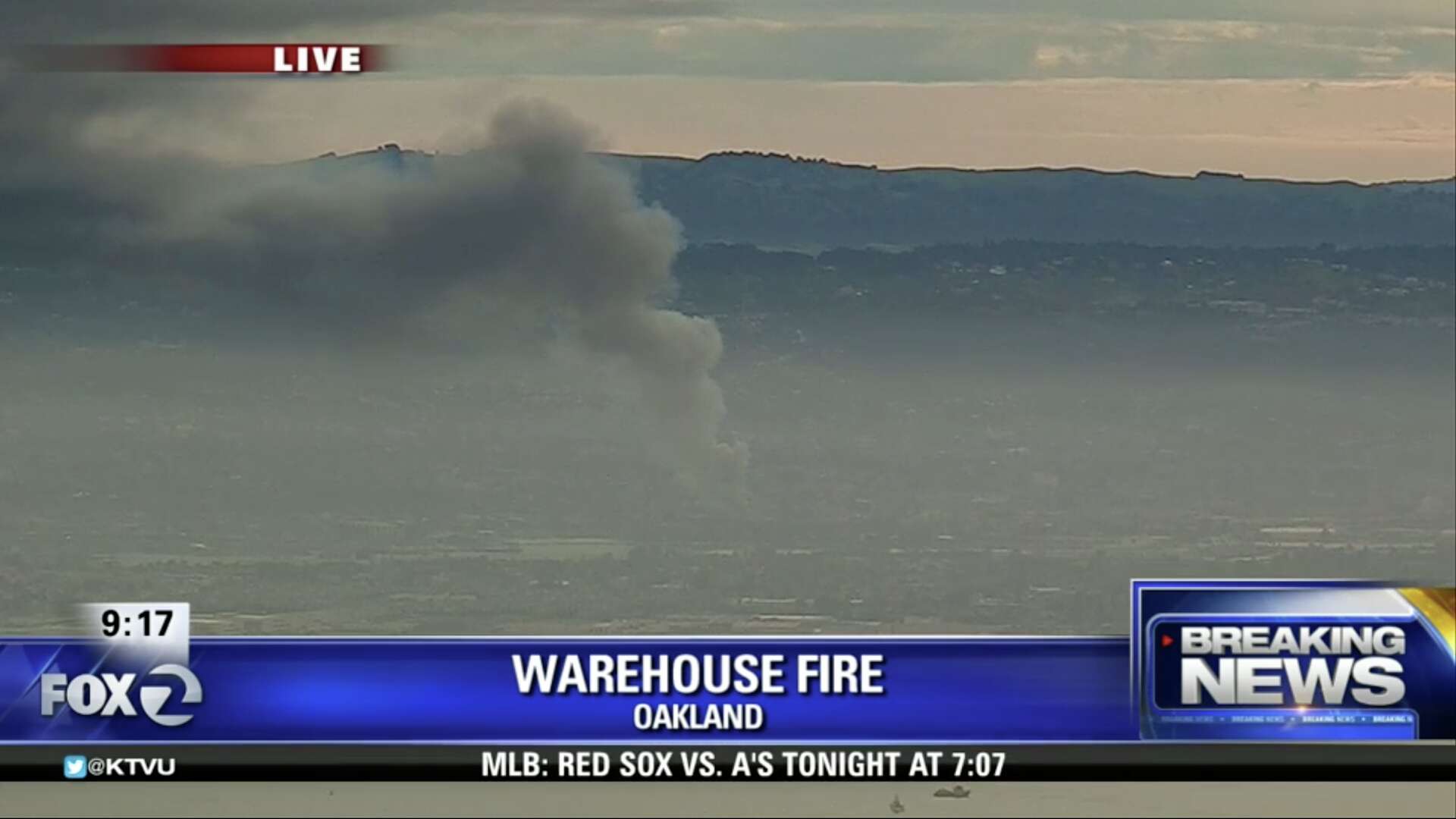 Fire in Oakland pumps out cloud of black smoke