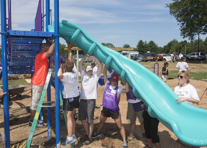 Volunteers build playground at YMCA in Milford