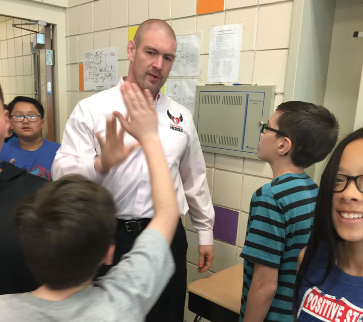 Former pro fighter delivers message about bullying