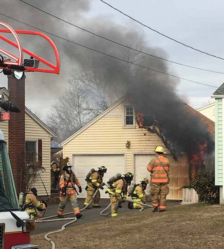 Ashes from wood burning stove spark garage fire