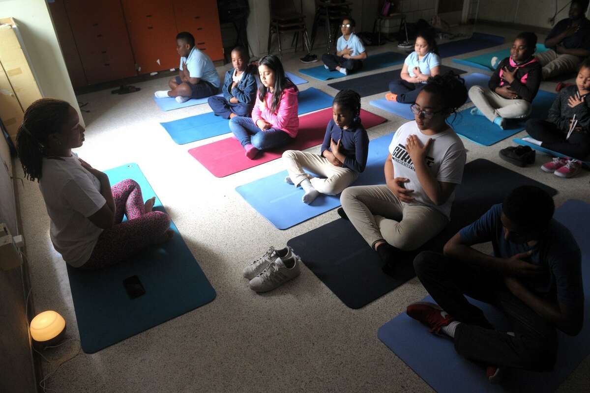 Bridgeport school turns to yoga to help calm students