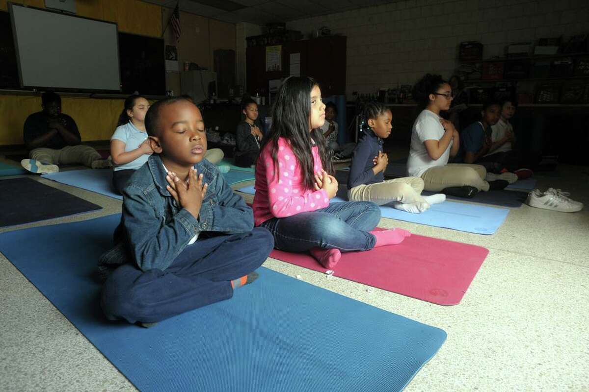Bridgeport school turns to yoga to help calm students
