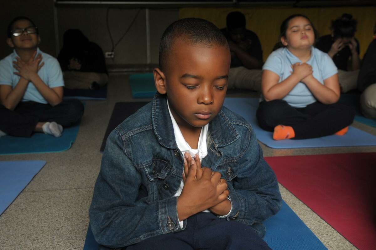 Bridgeport school turns to yoga to help calm students