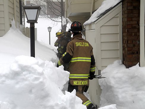 Firefighters work through the snow, rescue people trapped on Isinglass ...